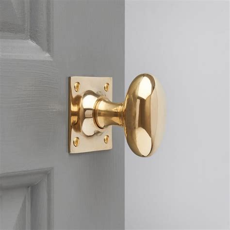 Oval Door Knobs On Square Back Plate Pair Polished Brass