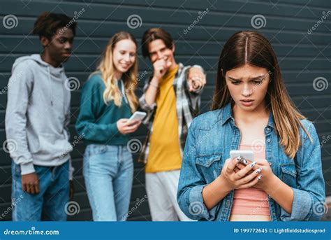 Focus Of Sad Teenager Holding Smartphone Stock Image Image Of Abuse