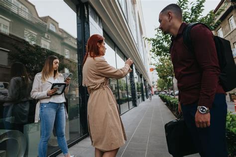 Creative Business Team Discussing Business Opportunities And Analyzing Statistics In A City