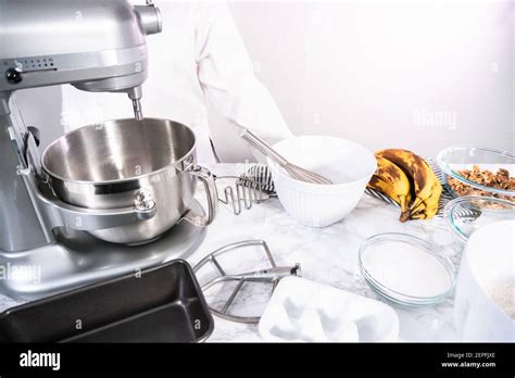 Mixing Ingredients In Kitchen Mixer To Bake Banana Nut Bread Stock