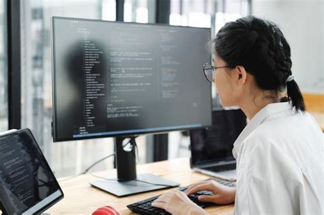 Premium Photo It Programmer Starts Working On Desktop Computer The