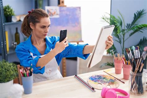 Young Woman Artist Make Photo To Draw With Serious Expression At Art