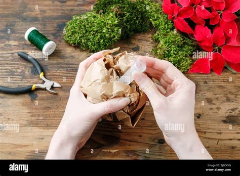 Florist At Work How To Make Christmas Table Decoration With Red Poinsettia Flower And Moss Ball