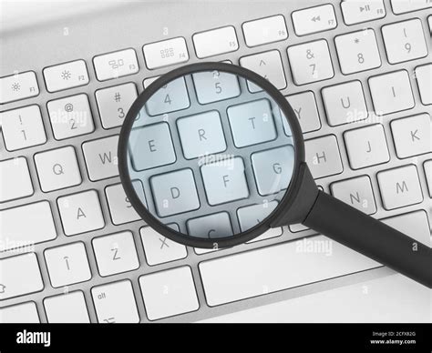 Magnifying Glass Over A Keyboard Stock Photo Alamy