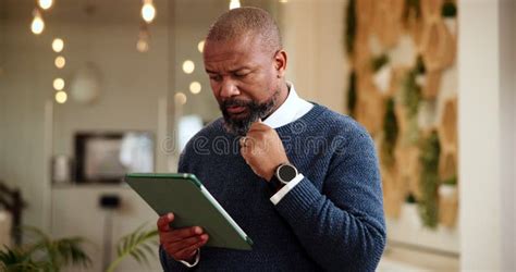 Office, Black Man and Thinking with Tablet for Problem Solving, Software Error and Developer for ...