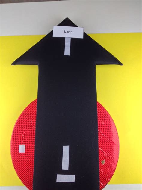 A Large Black Padded Arrow Bought From Ikea Located On A Lazy Sue Spin