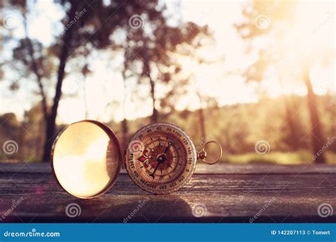 A Compass Over Wooden Table At Sunset Light Stock Image Image Of Navigate Equipment 142207113