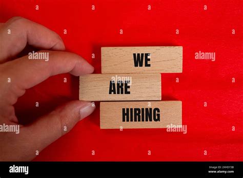 we are hiring message written on wooden blocks with color background