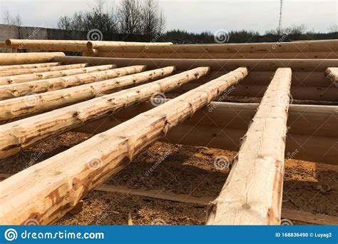 Drying And Assembly Of Wooden Log House At A Construction Base Stock