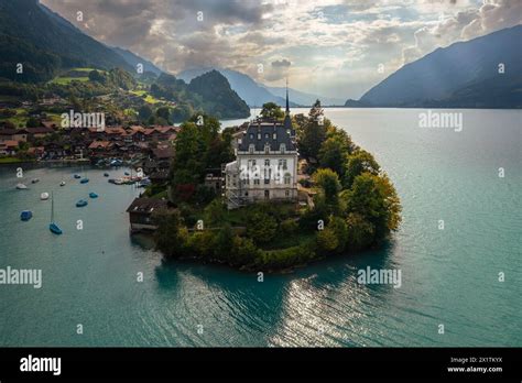 Iseltwald Village On A Peninsula In Lake Brienz On A Dramatic Cloudy