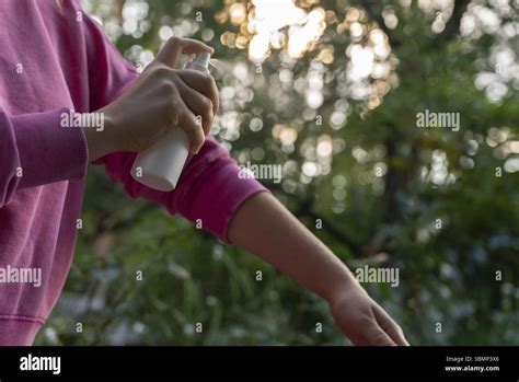 Hand Applying Insect Repellent Mosquito Insecticide Spray To Kill Flies
