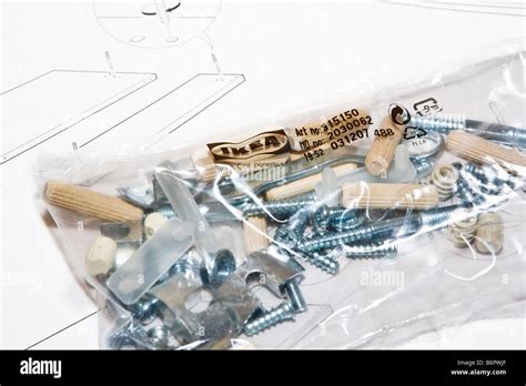 A Packet Of Ikea Flatpack Tools And Furniture Parts On Top Of Assembly