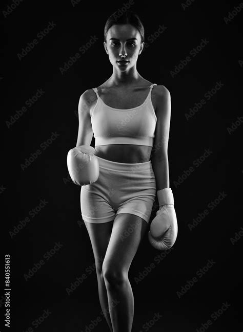 Beautiful Sexy Girl In A White Tracksuit With White Boxing Gloves On A