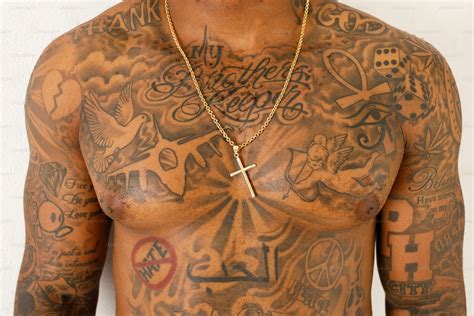 A Man With A Cross Tattoo On His Chest Photo Hope Image On Unsplash