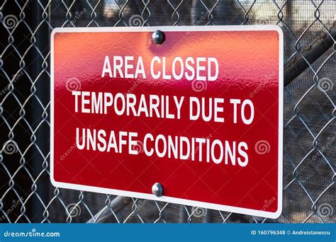 `area Closed Temporarily Due To Unsafe Conditions` Posted Sign Stock
