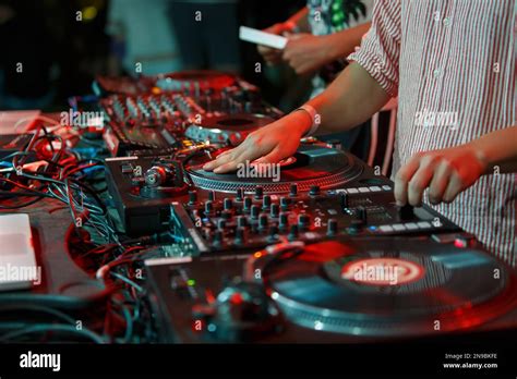 Hip Hop Dj Scratches Vinyl Record On Party In Night Club Hands Of