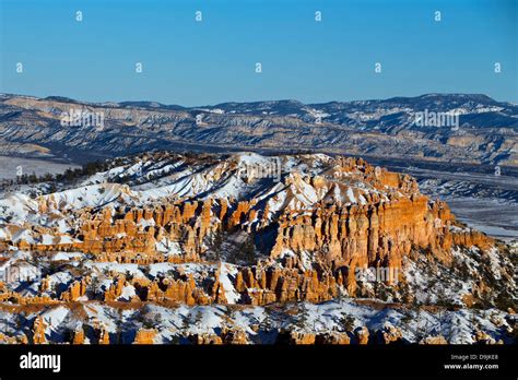 Hoodoo Rock Formations And Snow At Sunset Bryce Amphitheater Bryce