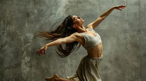 A Woman With Long Hair Is Dancing With Her Arms Outstretched Premium