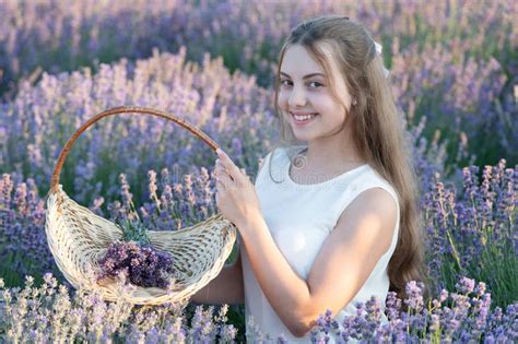 Portrait Of A Glad Young Girl With Long Hair In A Lavender Field Girl