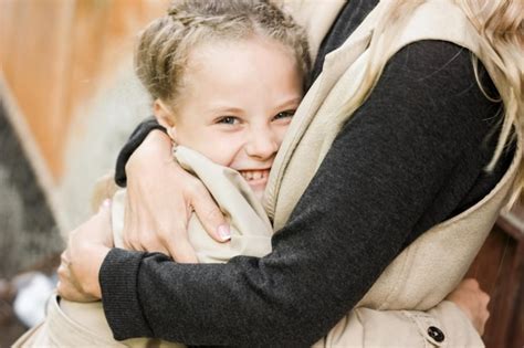 Premium Photo Portrait Of Cute Girl Embracing Mother