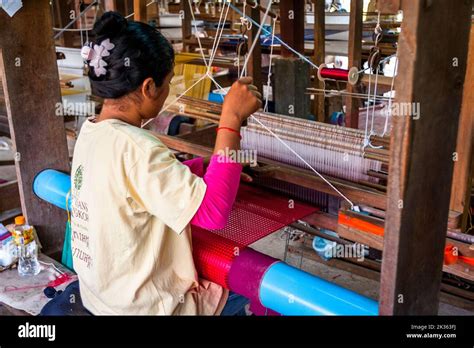 A Female Worker Uses Her Machine To Make Fabric With The Silk Threads Stock Photo Alamy