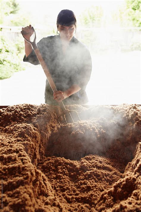 Spa Practitioner Preparing A Hot Japanese Enzyme Bath For Guest At Spa