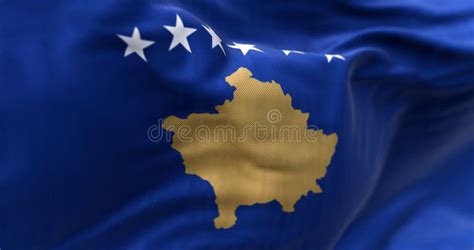 National Flag Of Kosovo Waving In The Wind On A Clear Day Stock