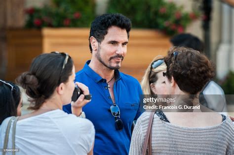 Actor Don Diamont poses with journalists as he is filming a scene of ...