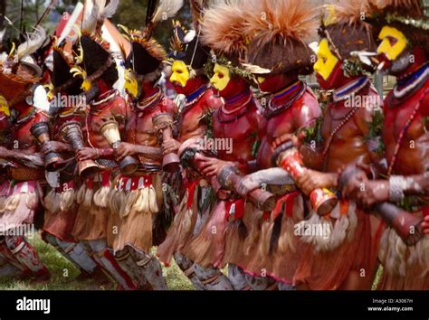 Huli Wigmen Beating Kundu Drum And Dancing At Sing Sing Festival Mt