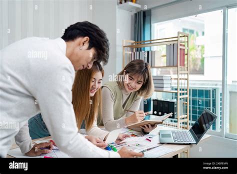 Creative Team Collaboration On Ux Ui Design Project In Modern Office Environment With Digital