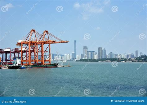 View On The Container Terminal And Gantry Cranes Loading Containers On The Cargo Ship Stock