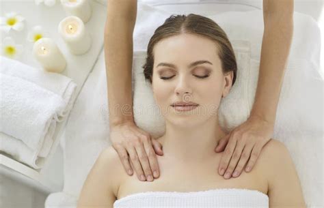 View From Above Of Young Woman Getting Professional Masseuse Stock