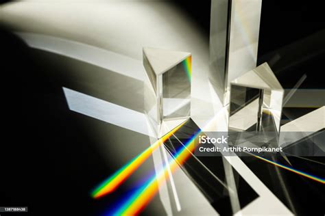 Multi Triangular Prism Dispersing Sun Beam Splitting Into A Spectrum On White Background Stock
