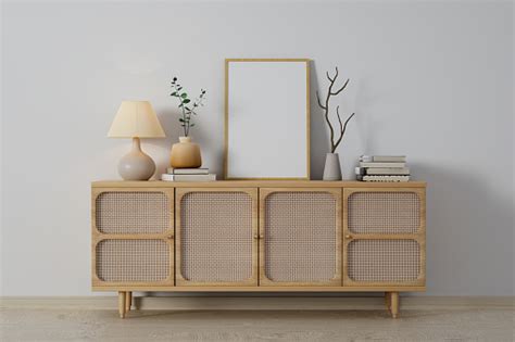 복사 공간이 있는 빈 포스터 프레임이 있는 벽 근처의 나무 캐비닛 현대 거실의 인테리어 디자인 3d 렌더링 그림 3차원 형태에