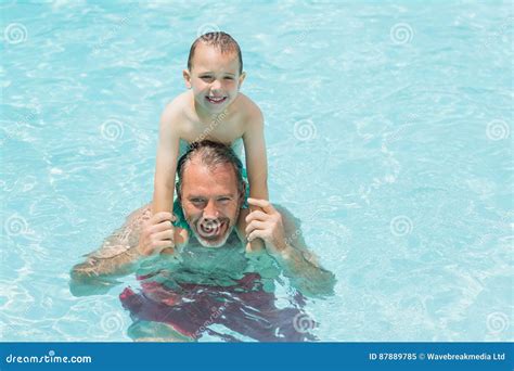 Portrait Of Father And Son In Swimming Pool Stock Image Image Of Life