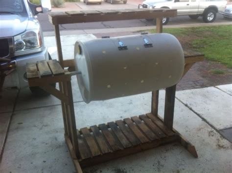 Tumbler Style Composter Made From A Plastic Food Barrel And Lumber From Recycled Shipping