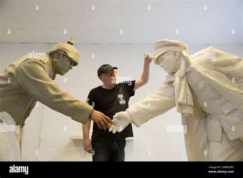 13 11 14 sculptor andrew edwards makes the finishing touches to the