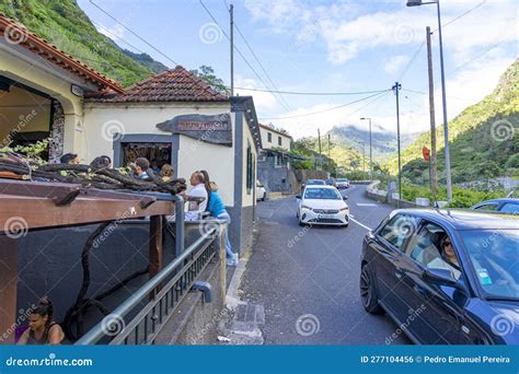 Exterior Of The Typical Poncha Tavern With Customers Consuming Drinks And Eating Peanuts With