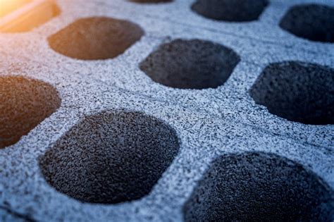 concrete blocks with holes stacked on top of each other stock image