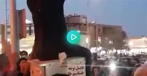 Women Cutting Her Hair In Solidarity While People Shout Death To The