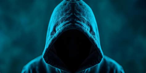 The Symbolism Of A Hooded Figure In Relation To Cybersecurity And