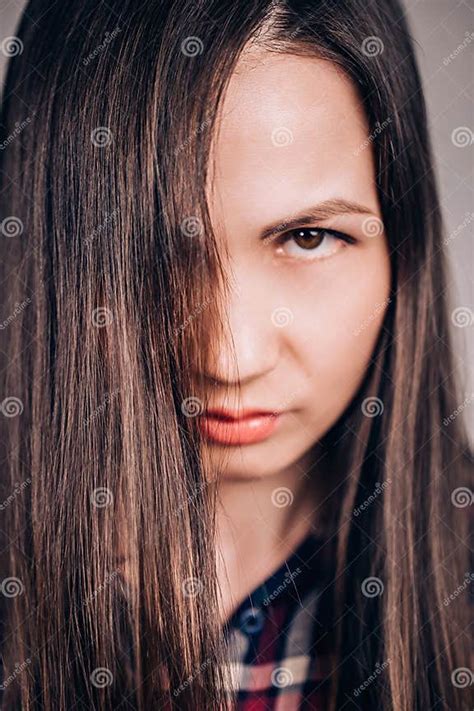 Closeup Portrait Of A Beautiful Woman Face Covered With Hair Stock