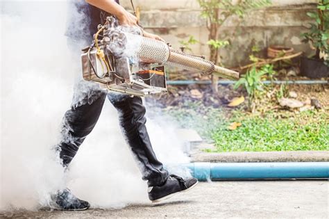 Premium Photo Pest Control Staff Spray Chemical Smoke Eliminate