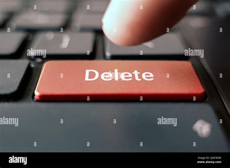 Male Finger Pressing Red Delete Black Keyboard Button Stock Photo Alamy
