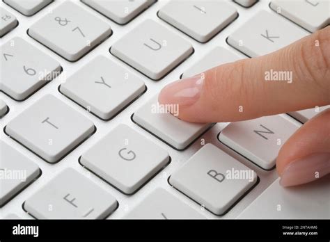 Woman Pressing Button On Computer Keyboard Closeup Stock Photo Alamy