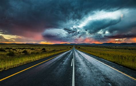 Stunning Landscapes: 4K Ultra HD Road Under Dramatic Clouds