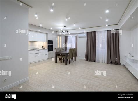 Large Modern New Well Designed White Kitchen In Studio Flat Interior