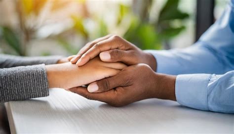 Two Hands Gently Holding Each Other Symbolizing Support Empathy And