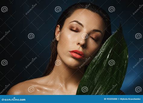 Exotic Style Fashion Photography Naked Woman Leaning To Green Plant