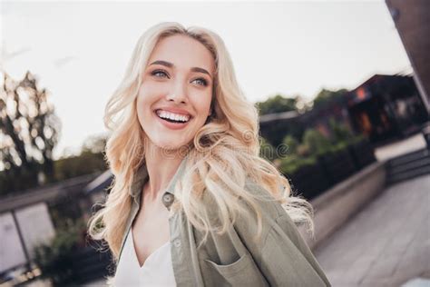 Portrait Of Attractive Cheerful Wavy Haired Girl Enjoying Spending